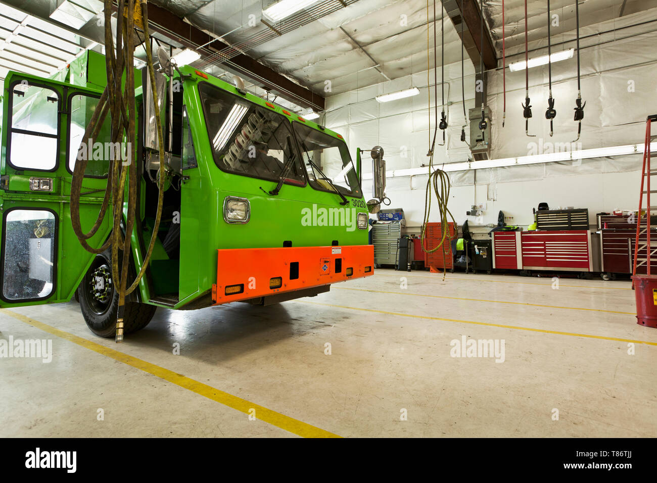 Green Garbage Truck Maintenance Stock Photo - Alamy