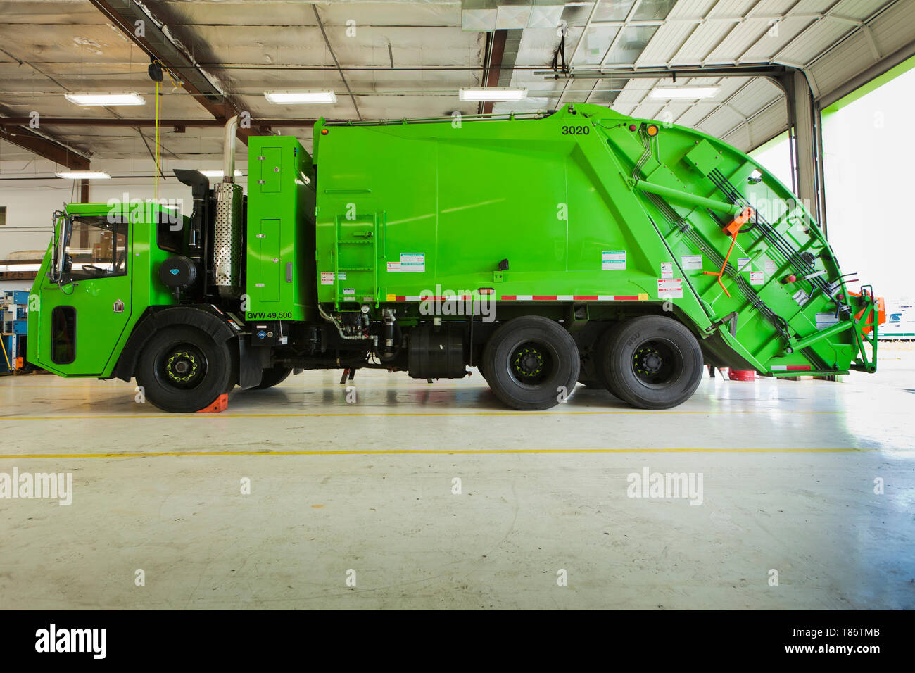 Green Garbage Truck Maintenance Stock Photo - Alamy