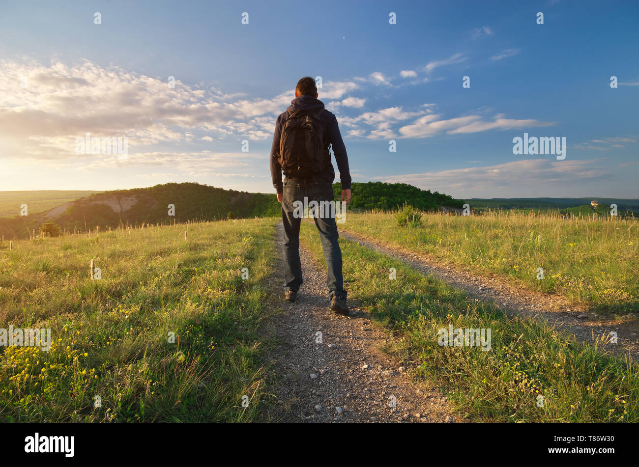 Person walk on the road lane. Traveling and turism scene Stock Photo ...