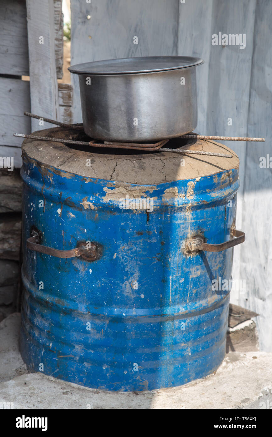 Traditional way of making tea on open tandoor oven in old Indian ...