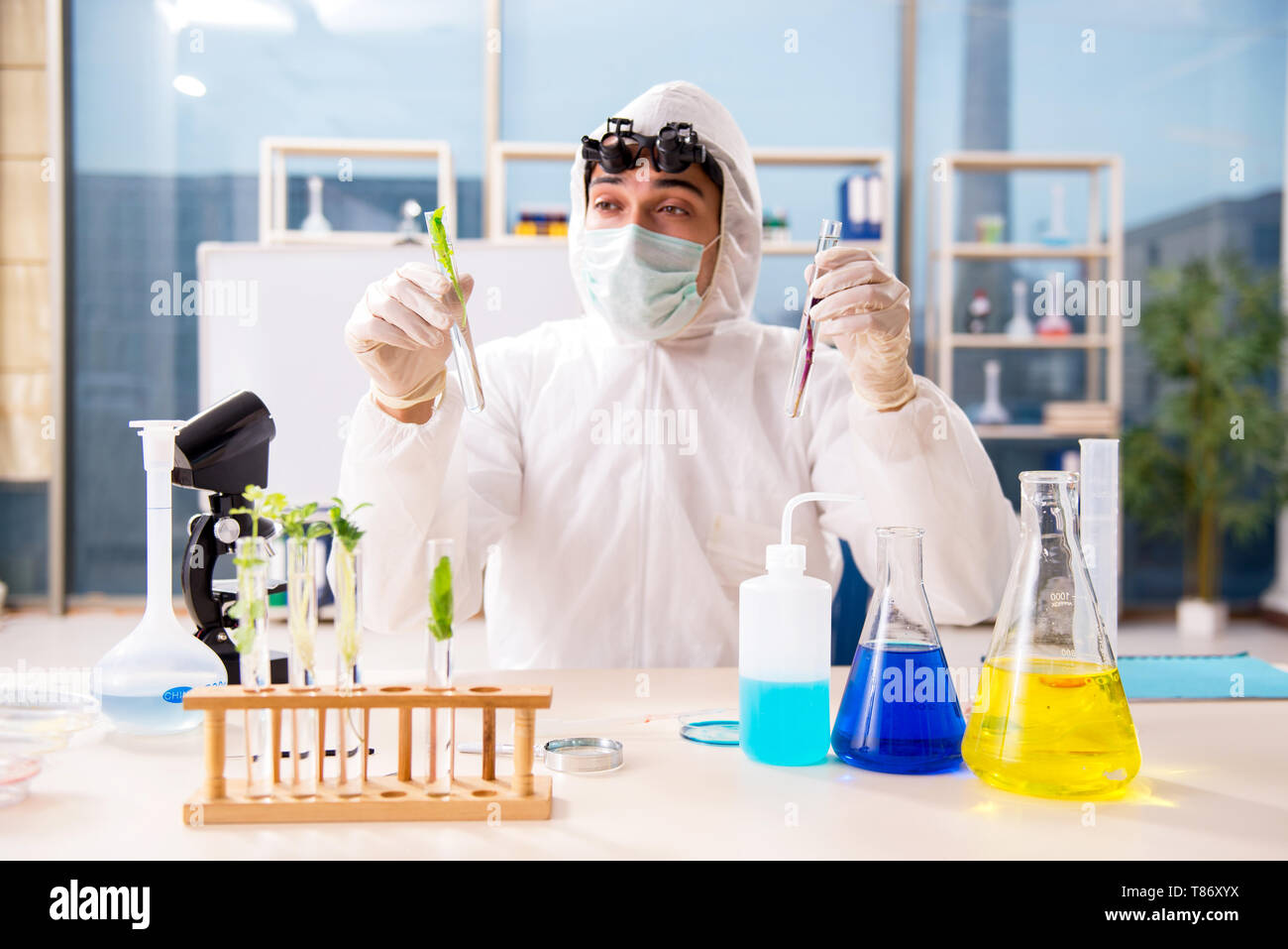 Male biotechnology scientist chemist working in the lab Stock Photo - Alamy