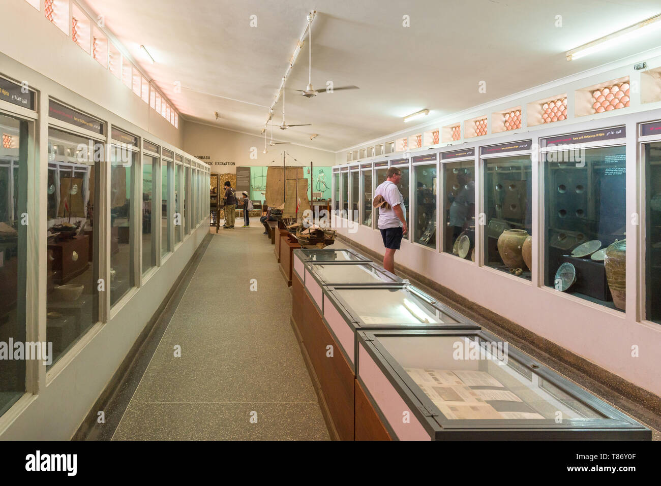Interior of the Fort Jesus museum gallery with tourists viewing the ...