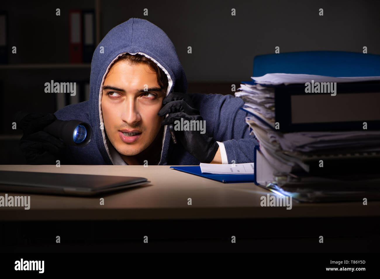 Thief trying to steal personal data in identity theft concept Stock ...