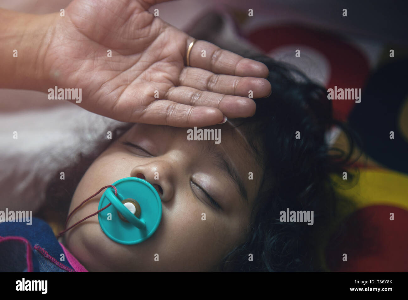 Child asleep with pacifier hi-res stock photography and images - Alamy