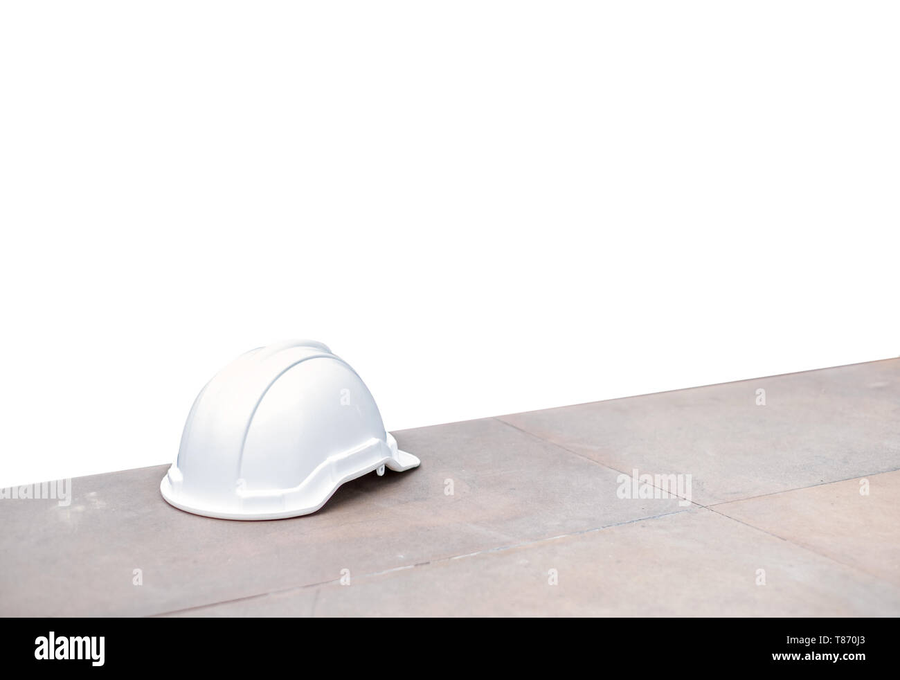 White safety hard helmet on concrete floor on white background Stock ...