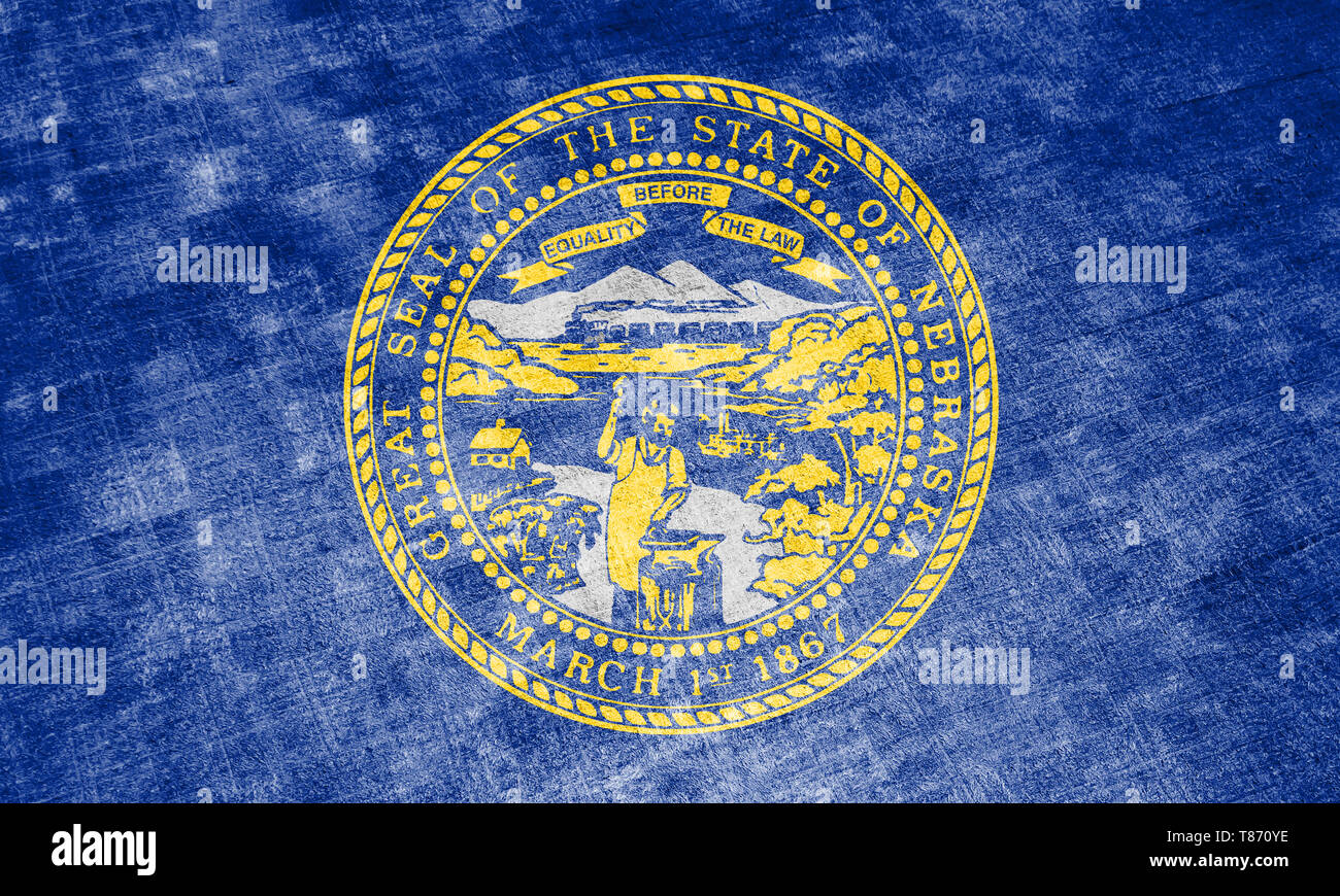 The national flag of the US state Nebraska in against a gray textile ...