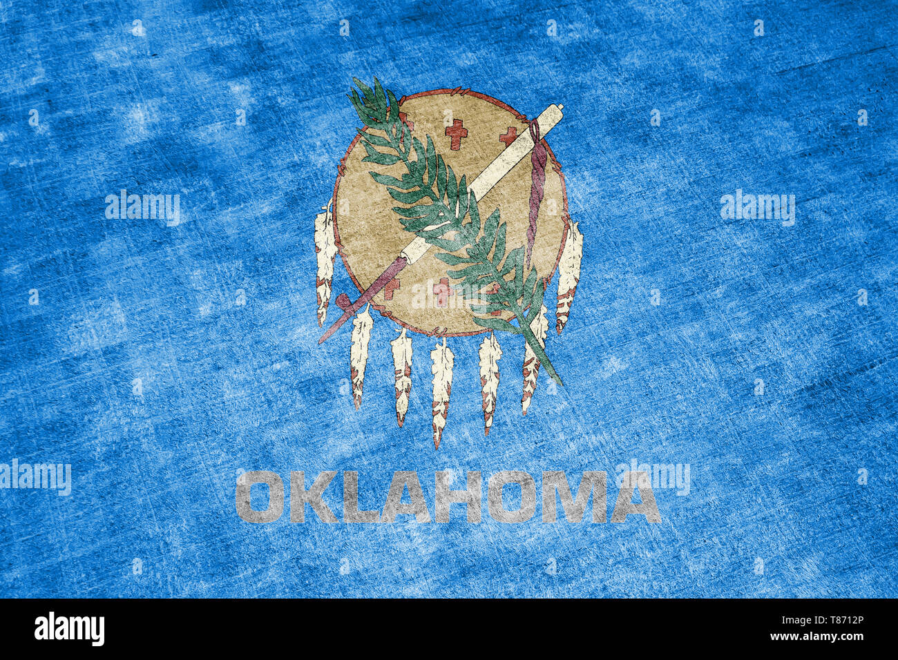 The national flag of the US state Oklahoma in against a gray textile ...