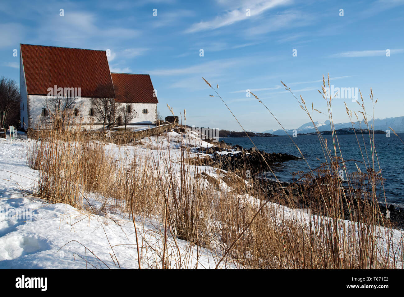 Trondenes Norway, winter scene of 13th century medieval church by the ...