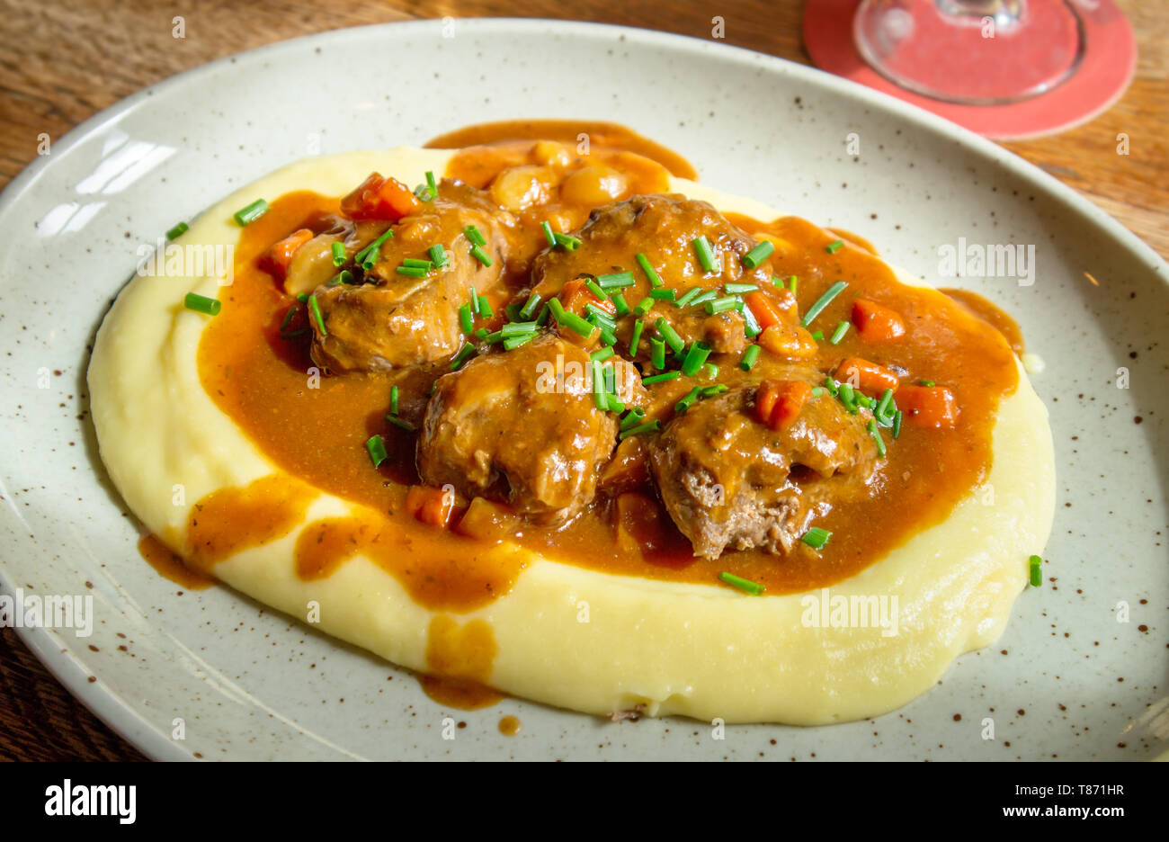Braised pig cheeks Stock Photo - Alamy