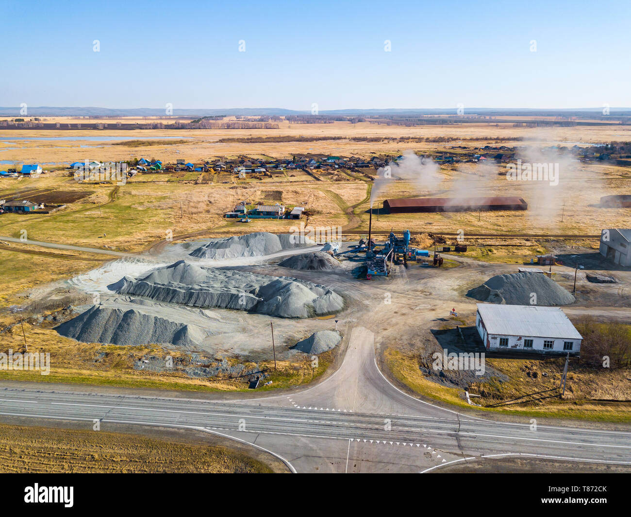 Aerial view of a small plant for the production and cleaning rubble and ...