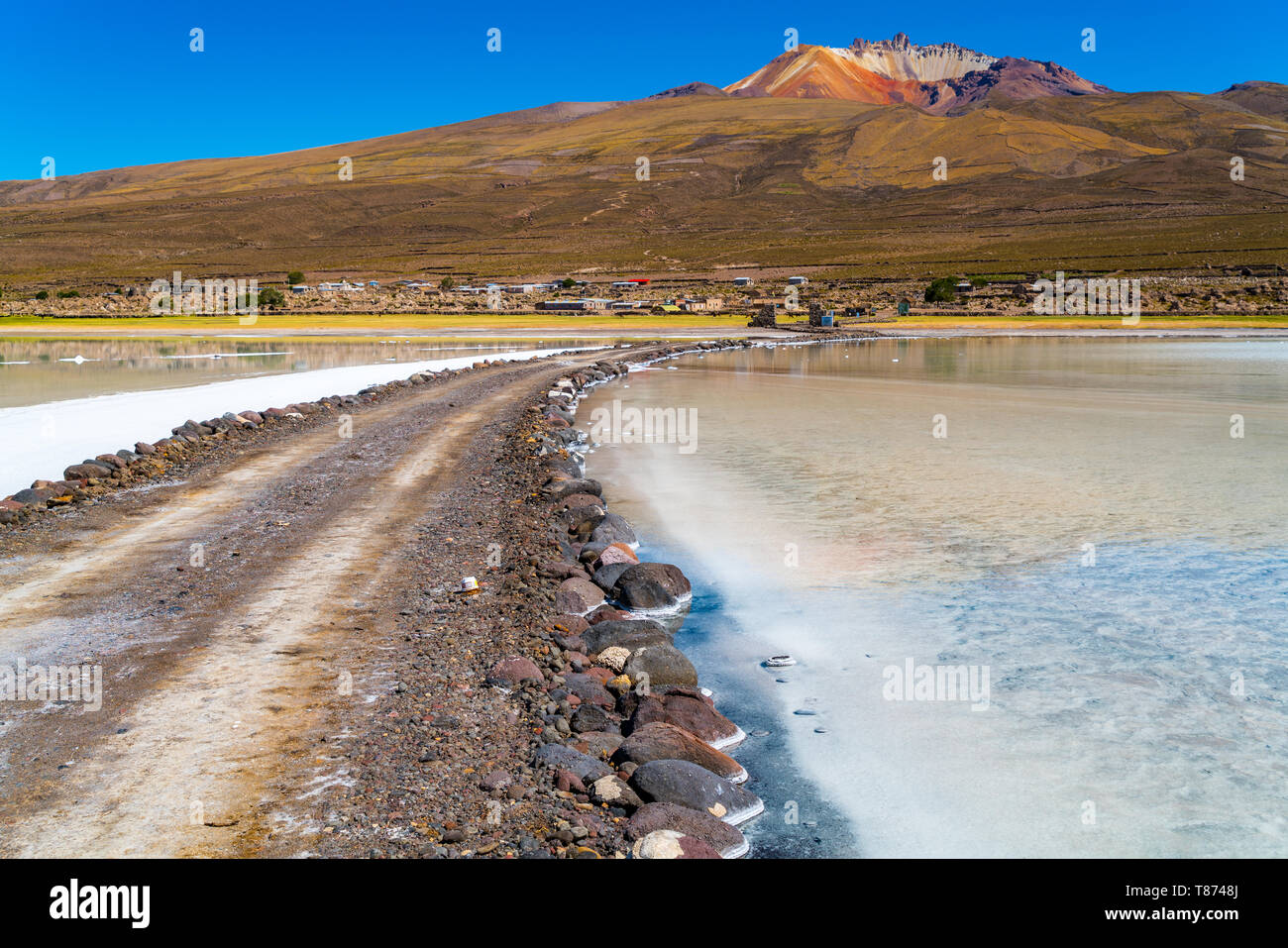 View of the dormant volcano Tunupa the village of Coqueza and the Uyuni ...