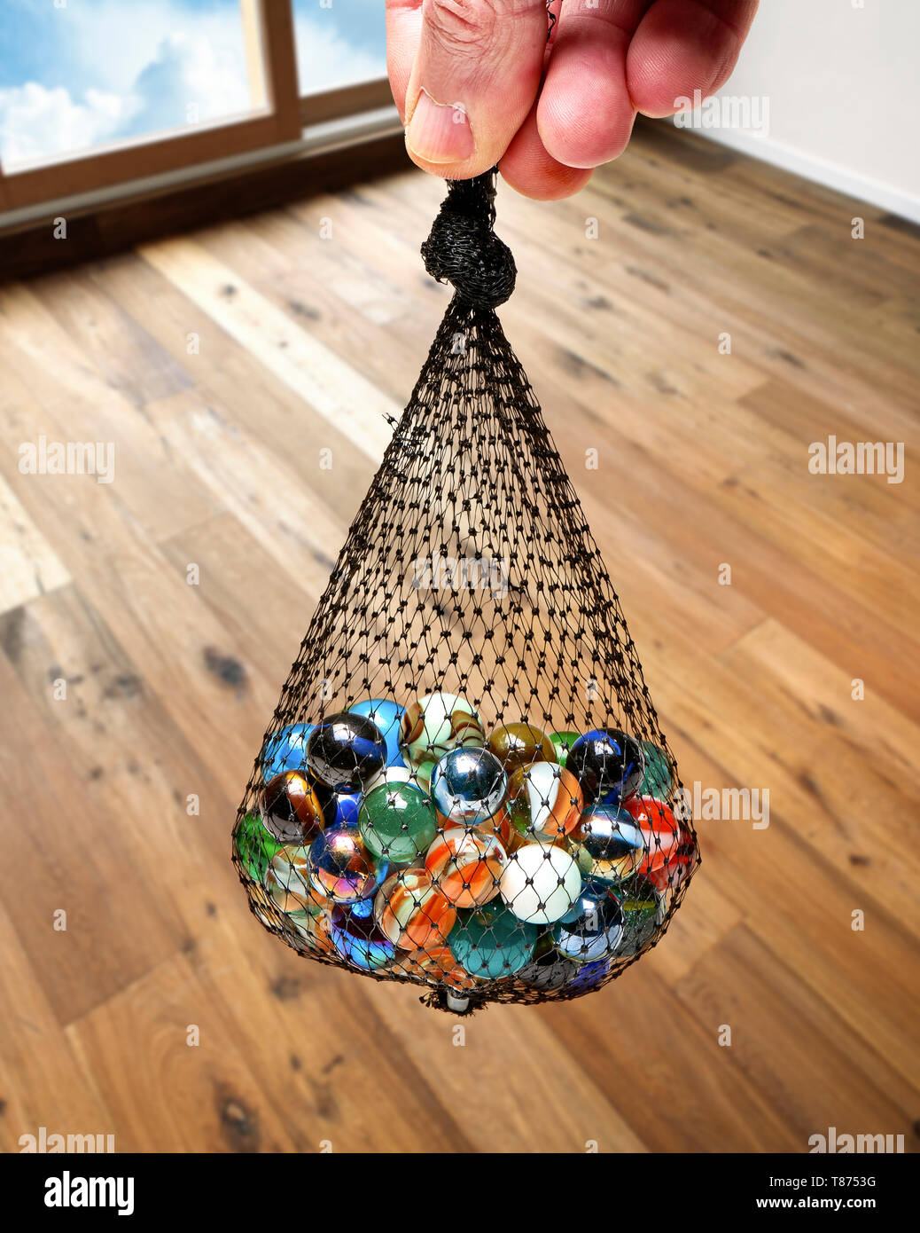Hand holding marbles hi-res stock photography and images - Alamy