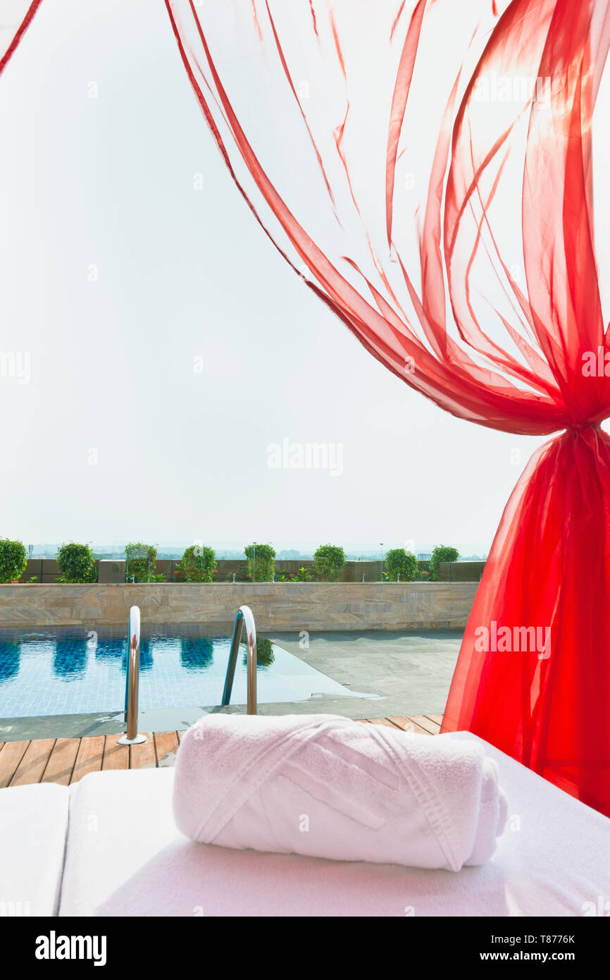 Bed Near a Resort Pool Stock Photo - Alamy