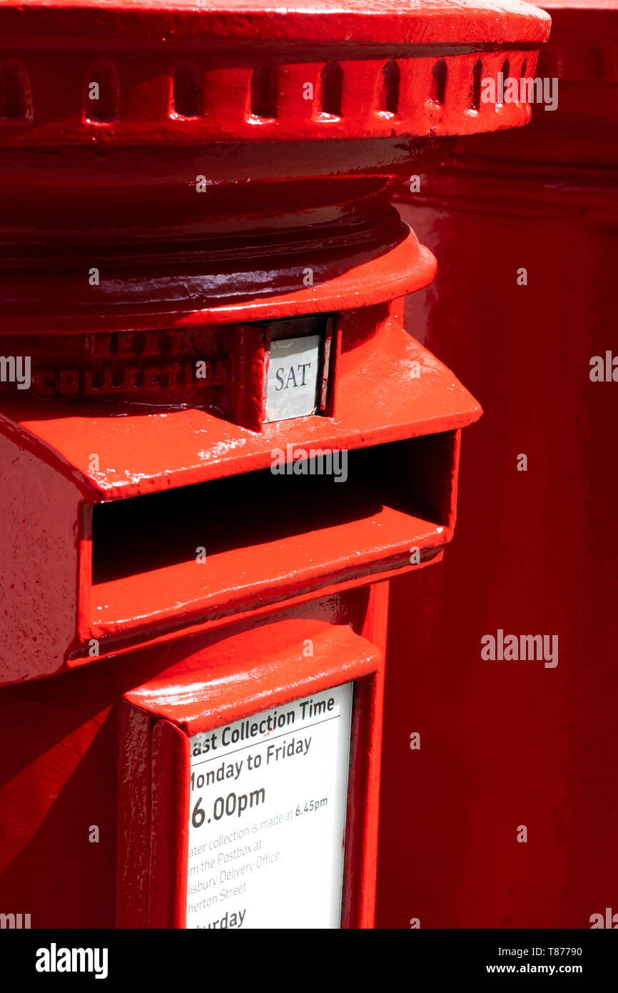 Red cast iron pillar boxes with SAT plate denoting the next collection ...