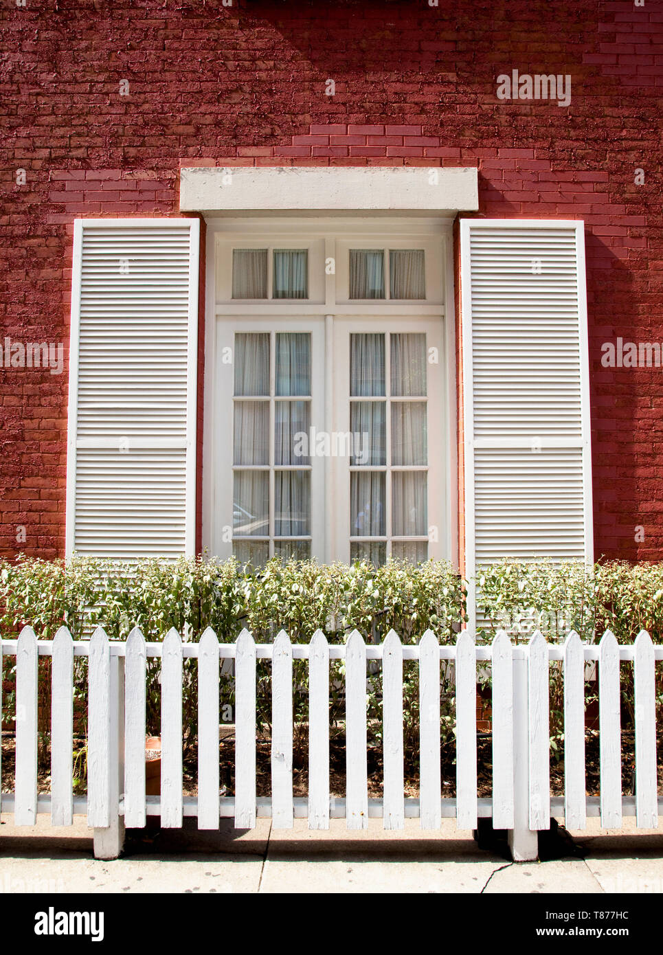 Brick Home and White Picket Fence Stock Photo - Alamy