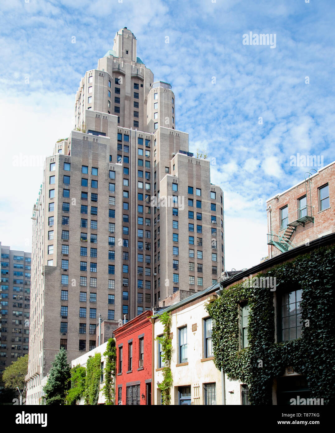 Skyscraper Towering Over Apartments Stock Photo - Alamy