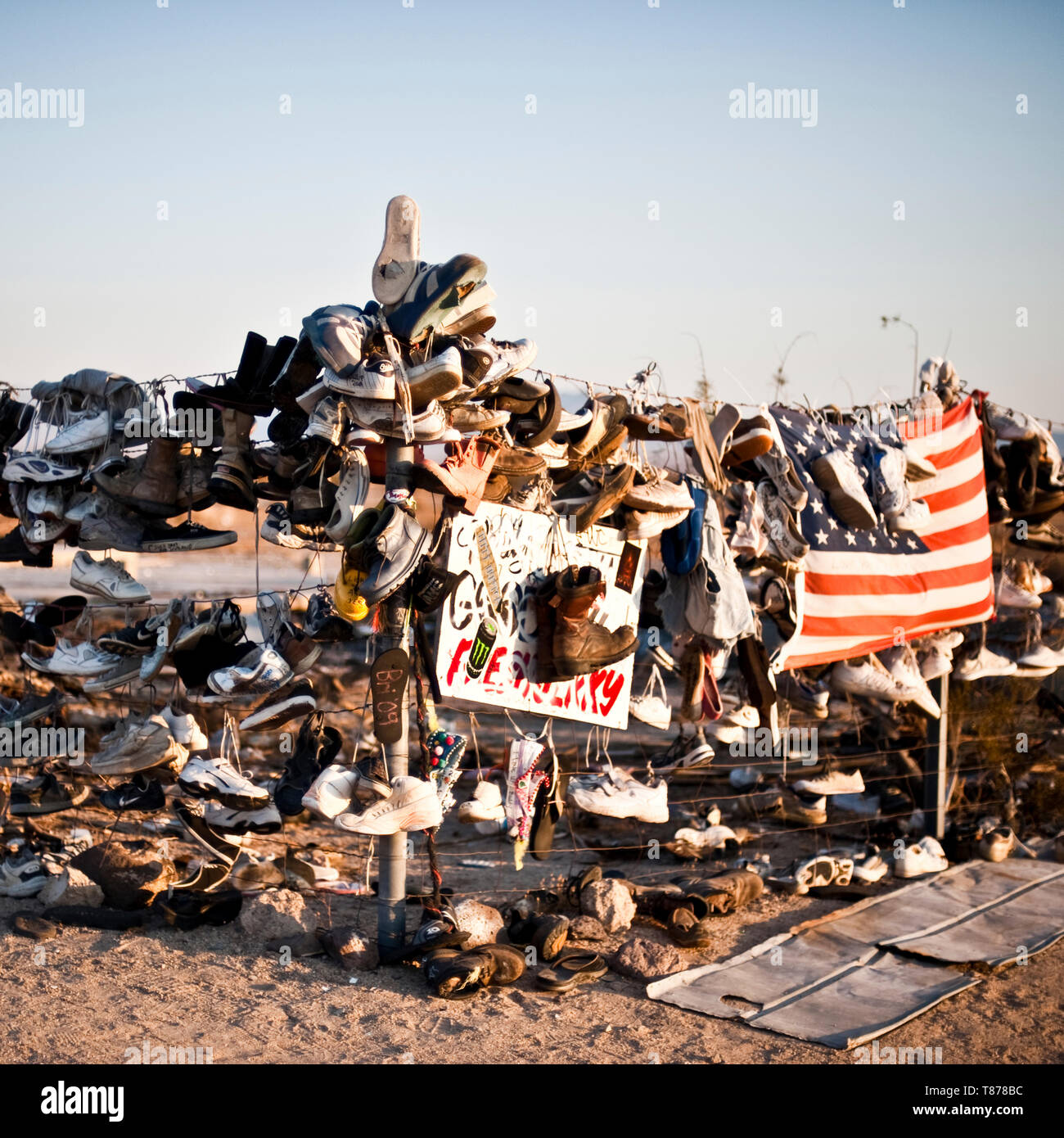 Shoes hanging on fence hi-res stock photography and images - Alamy