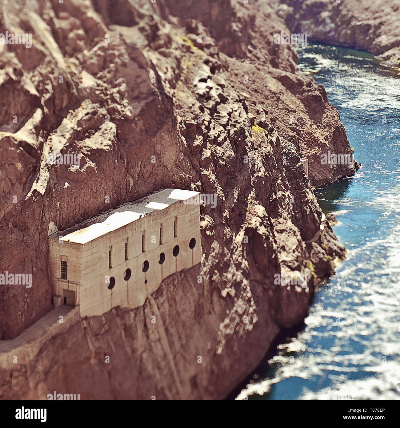 Building Built into River Valley Cliff Stock Photo - Alamy