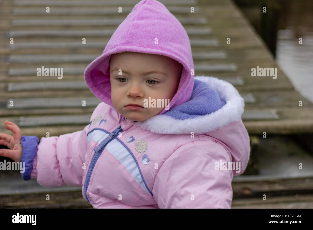 20 months old baby enjoying the nice weather outside. Toddler girl ...