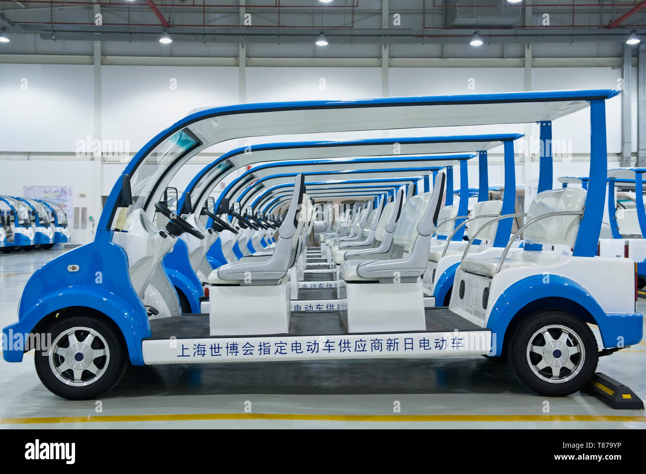 Electric Vehicles in a Warehouse Stock Photo - Alamy