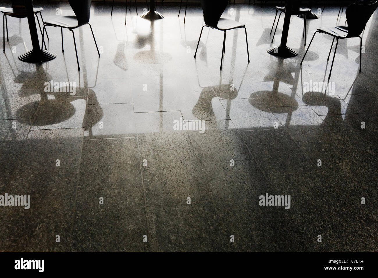 Reflections of Tables and Chairs on Shiny Floor Stock Photo - Alamy
