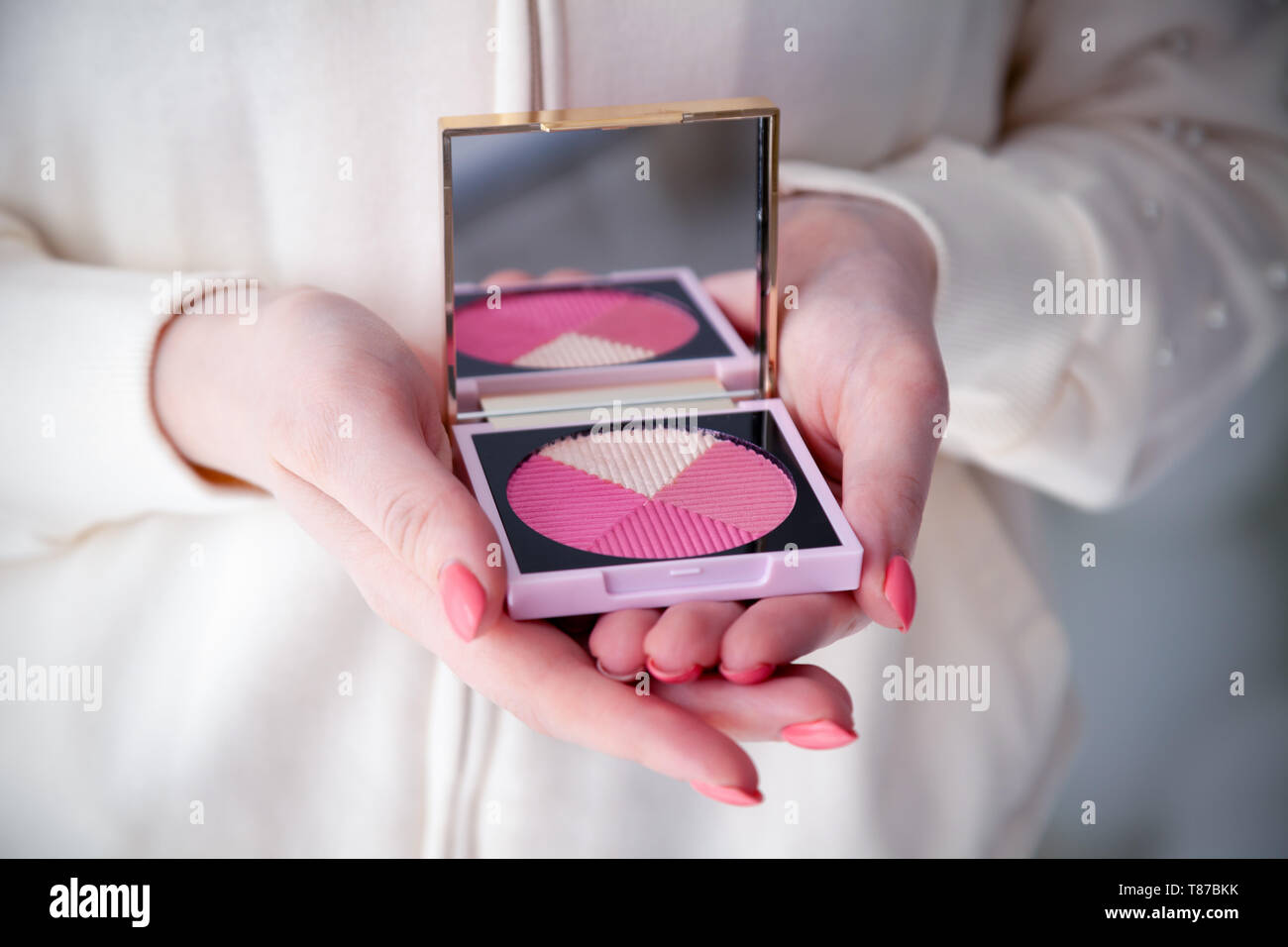 Closeup female hands with manicure holding corrective sculpting palette ...