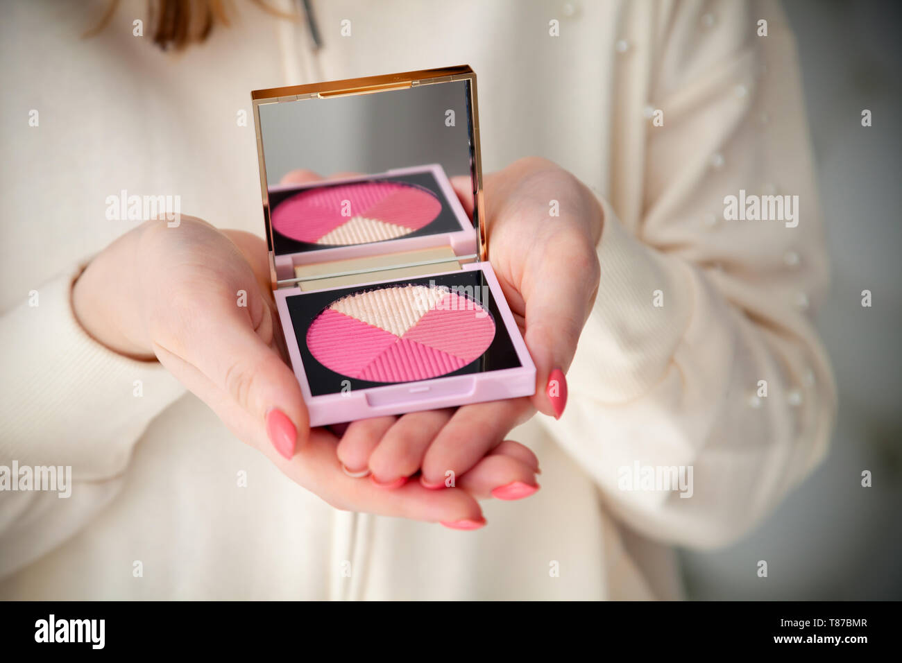 Closeup female hands with manicure holding corrective sculpting palette ...