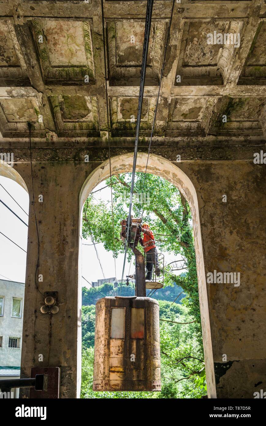Georgia, Chiatura, mining town cable cars and repairman Stock Photo - Alamy