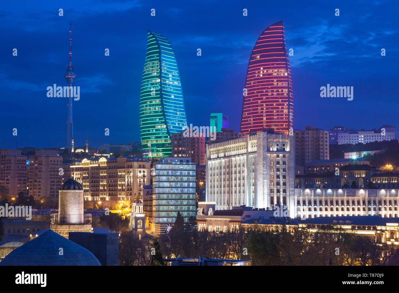 Azerbaijan, Baku, high angle skyline view with The Flame Towers, dusk ...