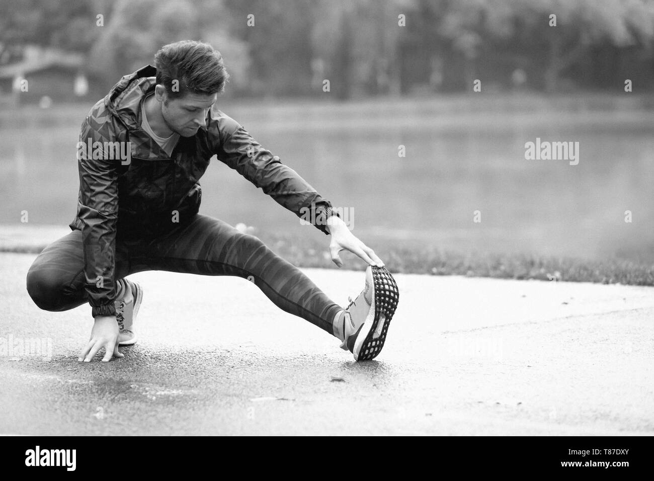 Athletic young man preparing for his morning running routine Stock ...