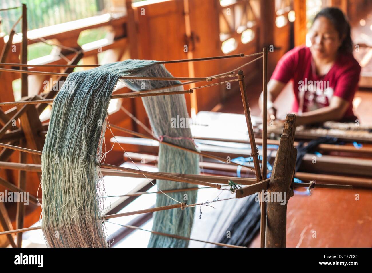 Laos, Vientiane, Lao Textile Museum, weaver working traditional Lao ...