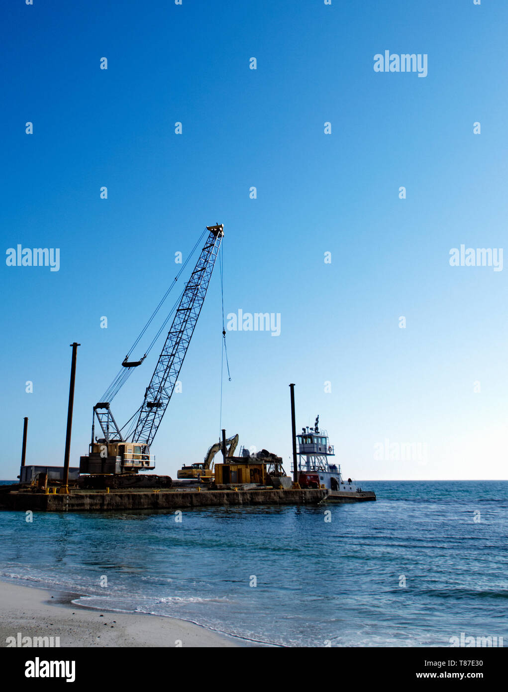 Machinery Cleaning Up a Pier Stock Photo - Alamy