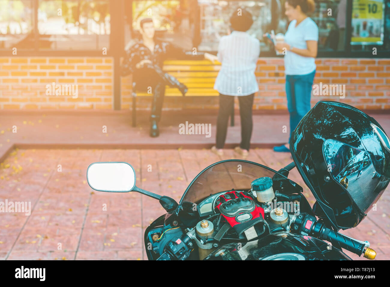 A sporty motorcycle parked in front of a coffee shop Stock Photo - Alamy