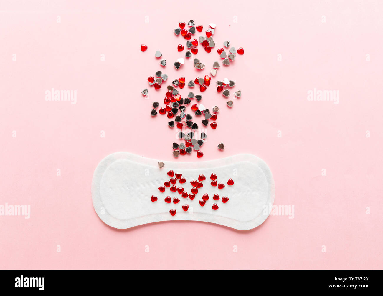 Feminine hygiene pad on a pink background. Concept of feminine hygiene ...