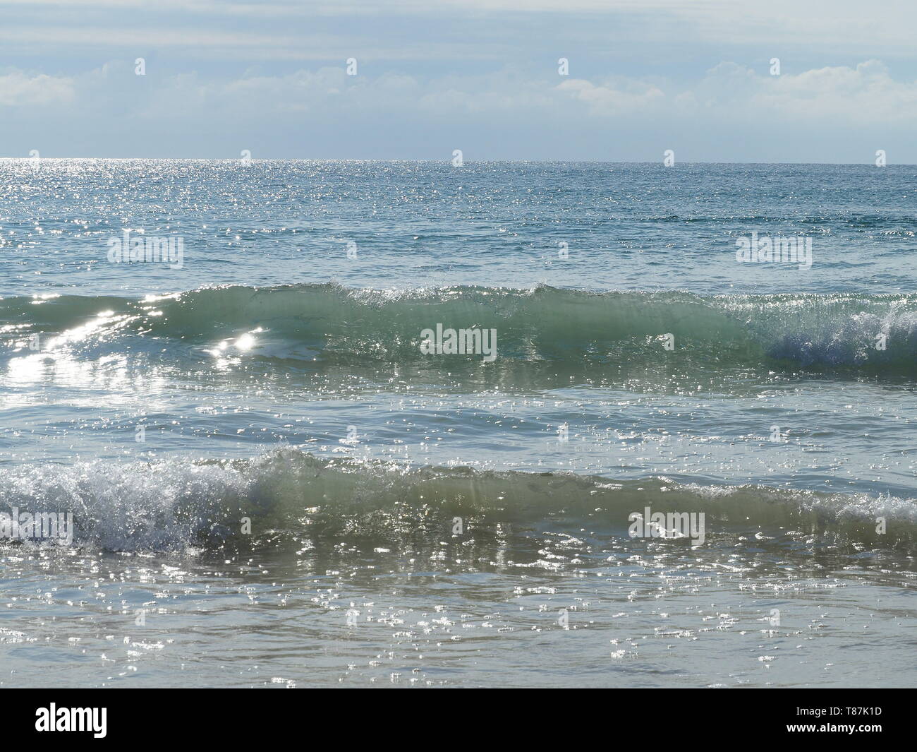Water, Glassy looking waves ,shining and glistening water, lit by ...