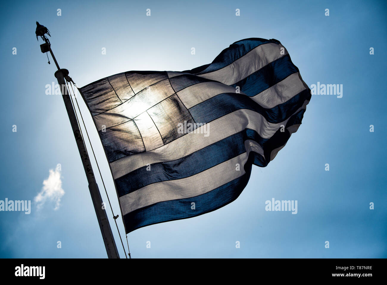 ATHENS, Greece — The Greek national flag flies against a bright sky ...