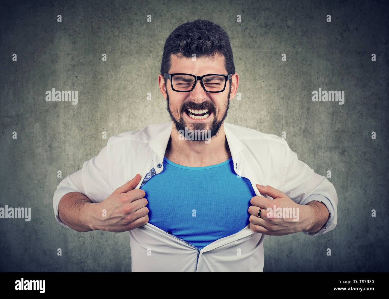 business man desperate for change unbuttons his shirt and becoming a ...