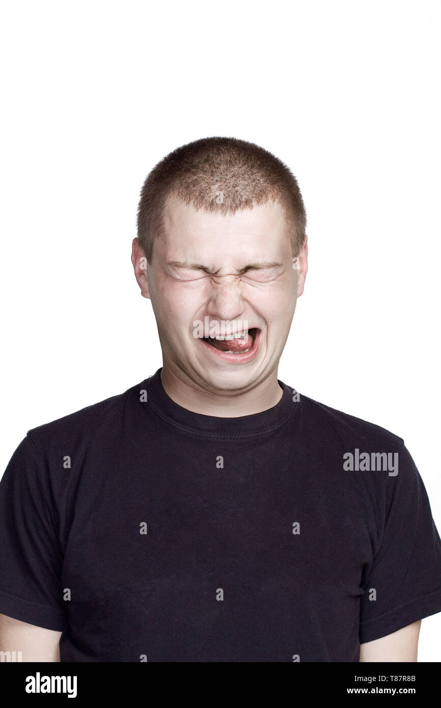 Portrait of young man. Facial expression. grimace with tongue Stock ...