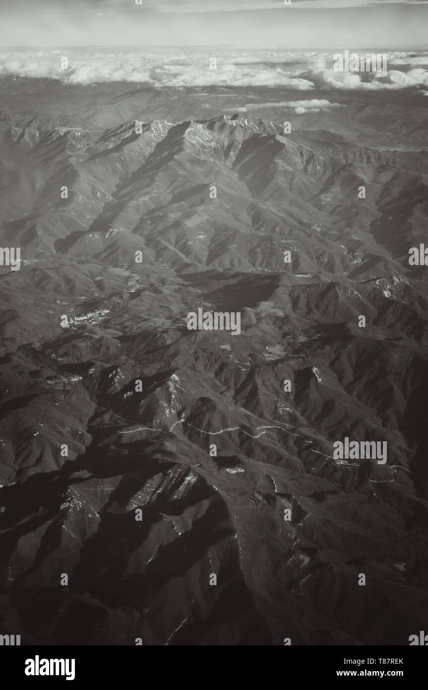 Aerial view from a plane of the Pyrenees mountains in Spain in black ...
