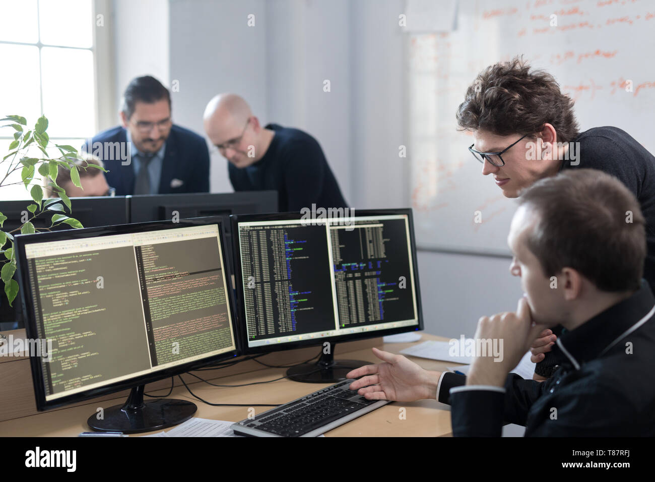 Startup business problem solving. Software developers working on ... Startup business problem solving. Software developers working on ...