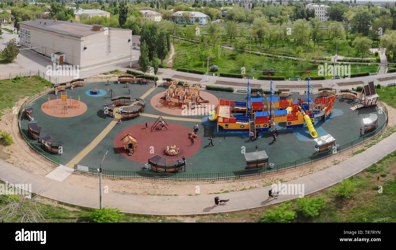 Children playground on yard activities in public park. Aerial view ...