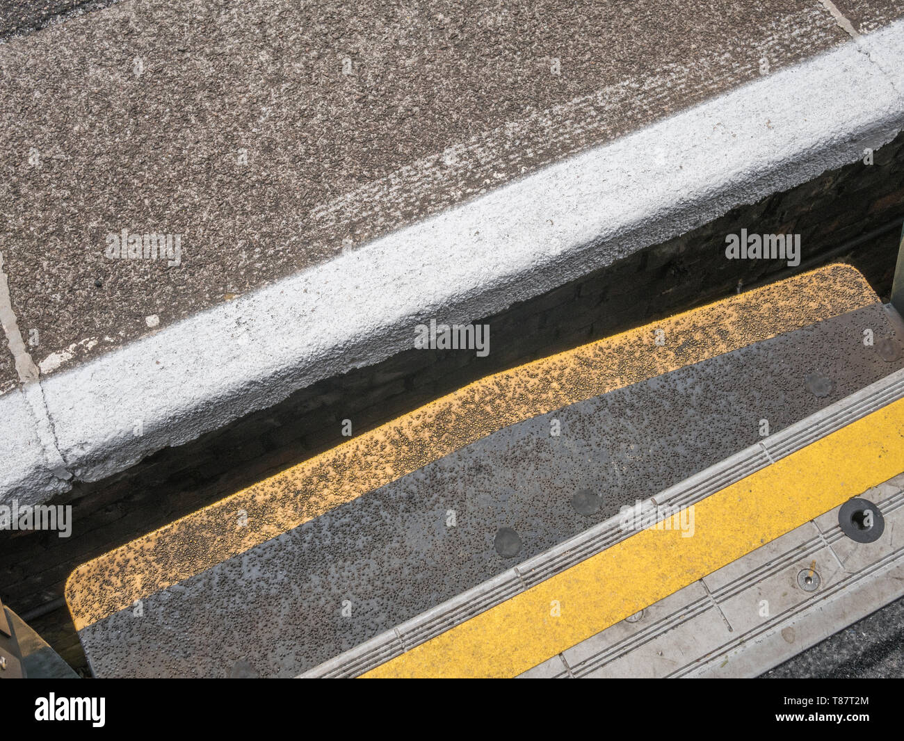 Gap between railway platform edge and railway carriage step painted ...