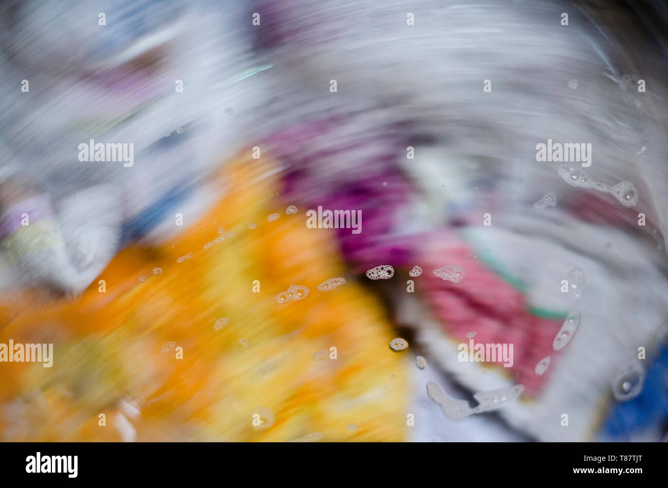 Washing machine rotating garments inside hi-res stock photography and ...