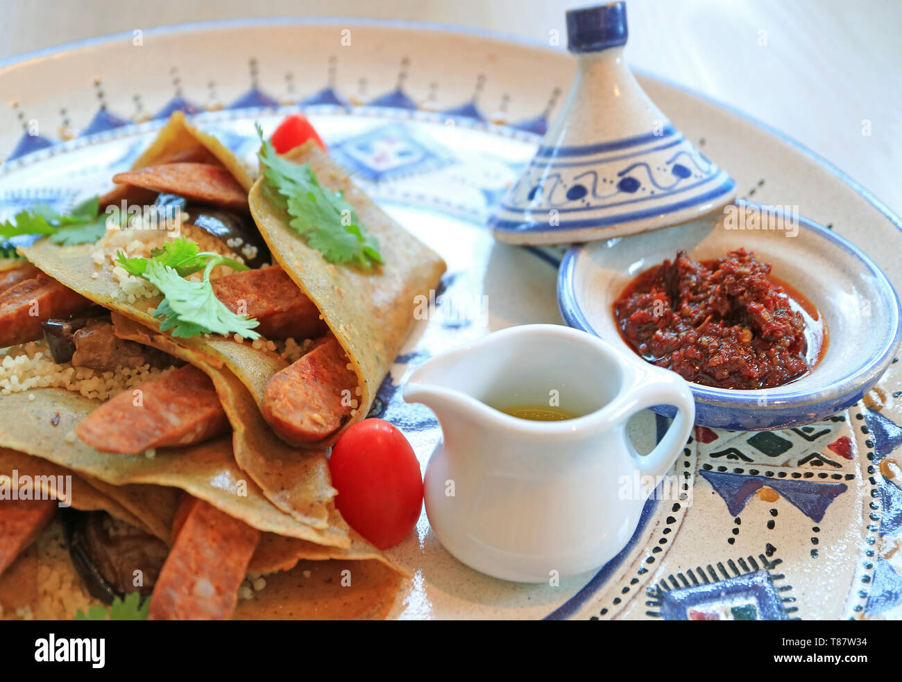Olive Oil and Moroccan Harissa Chili Sauce Served with Savoury Couscous ...