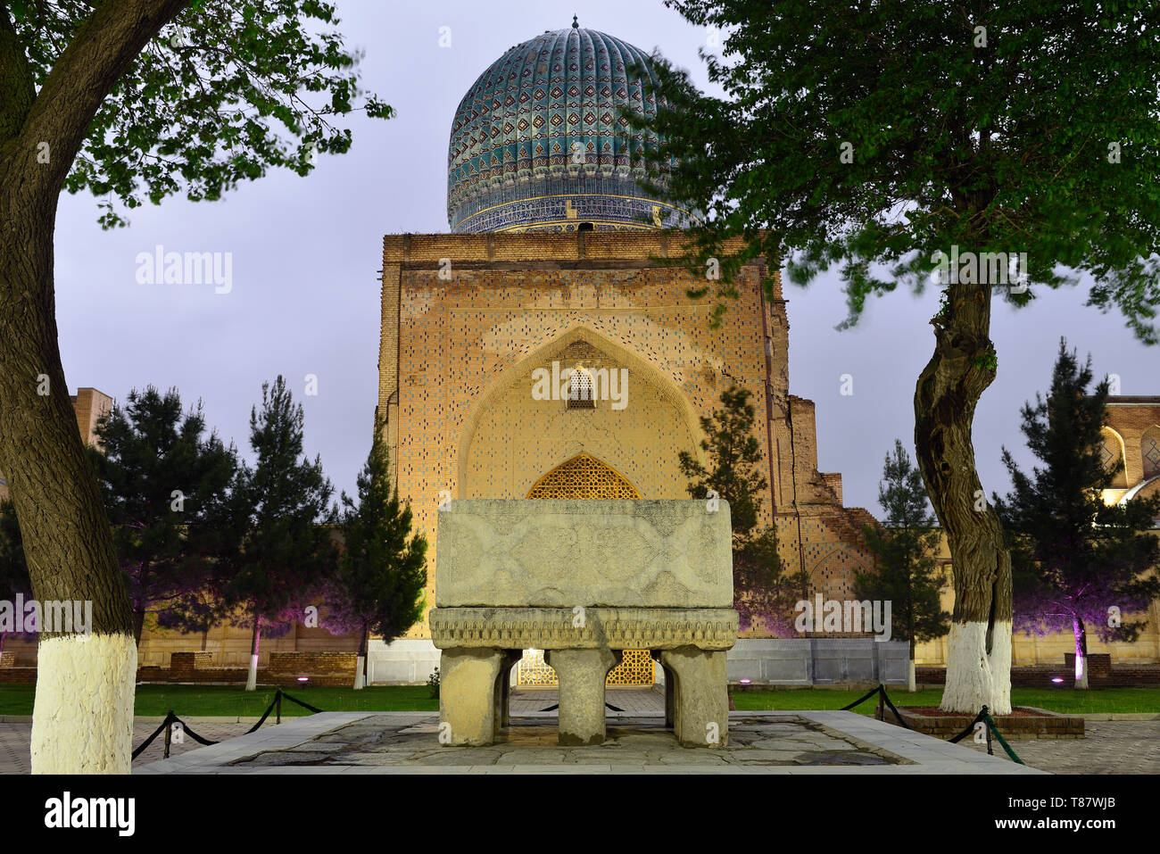 View on the marble Quran stand. Bibi-Khanym mosque at night, one of the ...