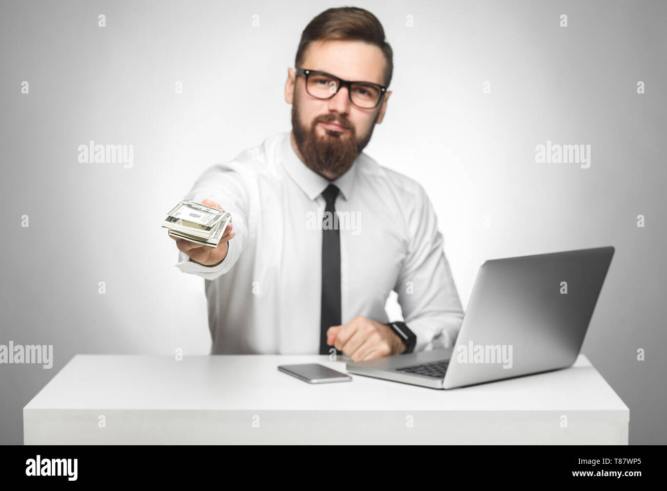 Money are yours! Portrait of handsome richman bearded young big boss in ...