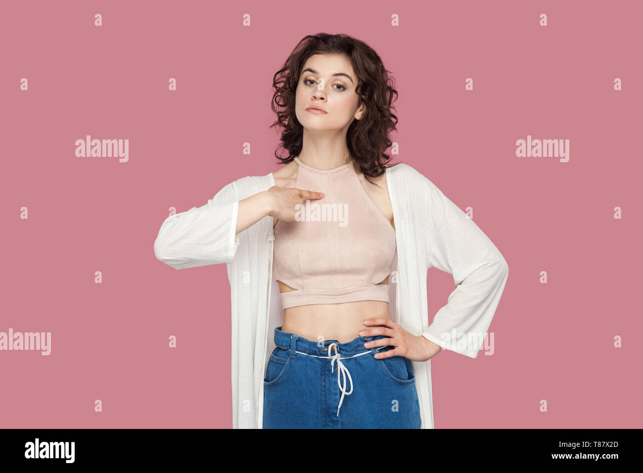 This is me. Portrait of haughty proud beautiful brunette young woman ...