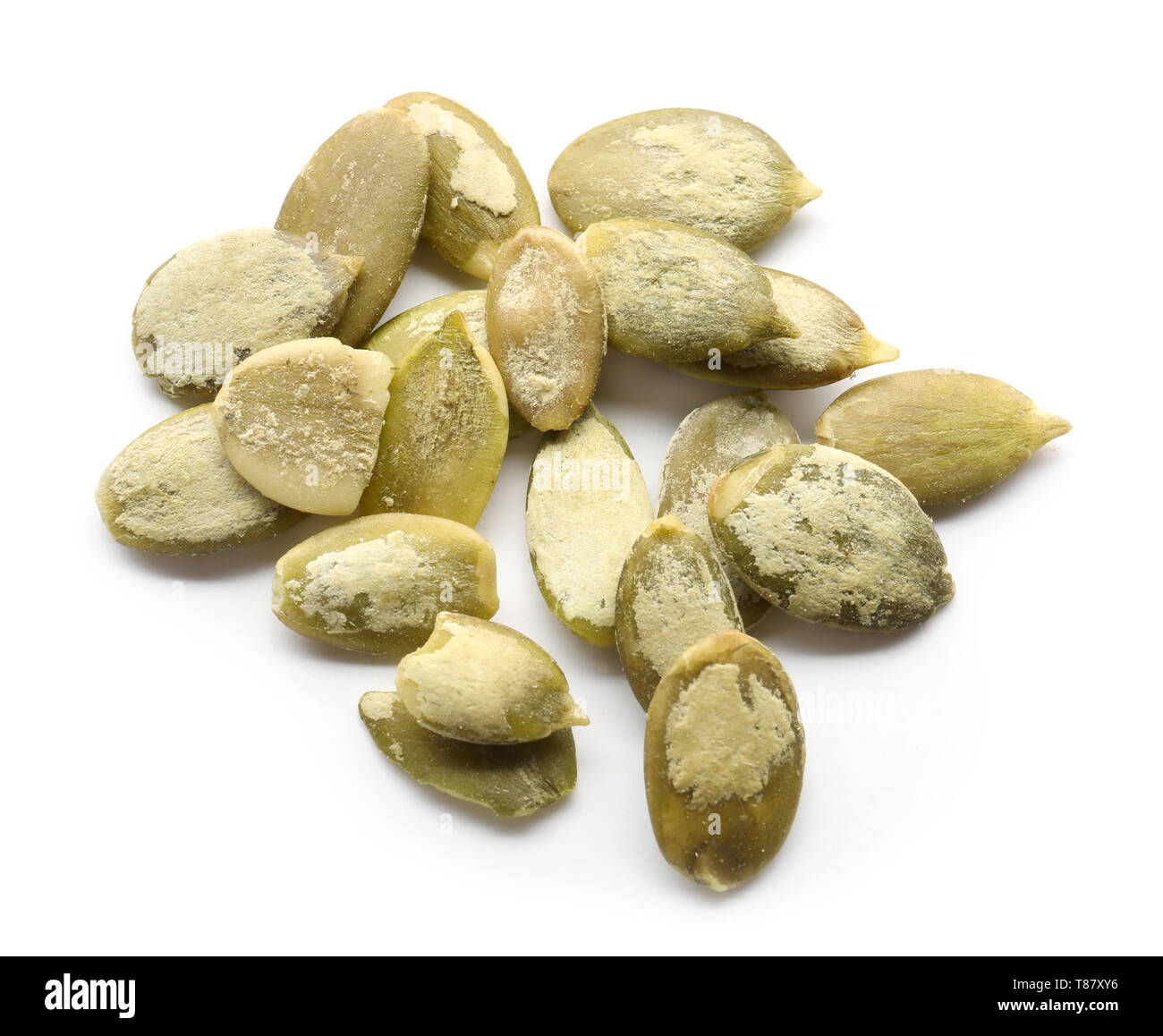 Pumpkin seeds on white background Stock Photo - Alamy