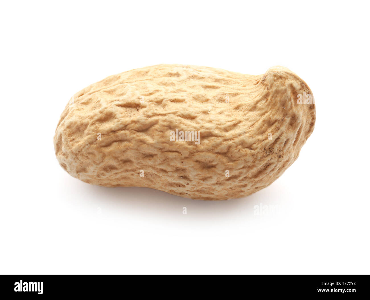 Unpeeled peanut on white background Stock Photo - Alamy