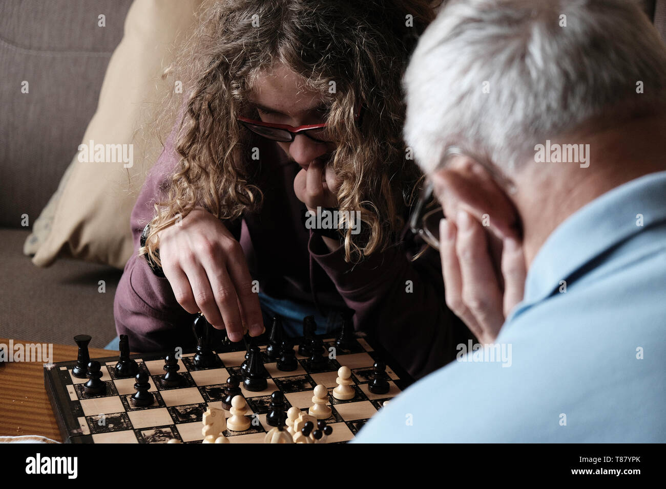 Grandfather and grandson playing chess, Poland Stock Photo - Alamy